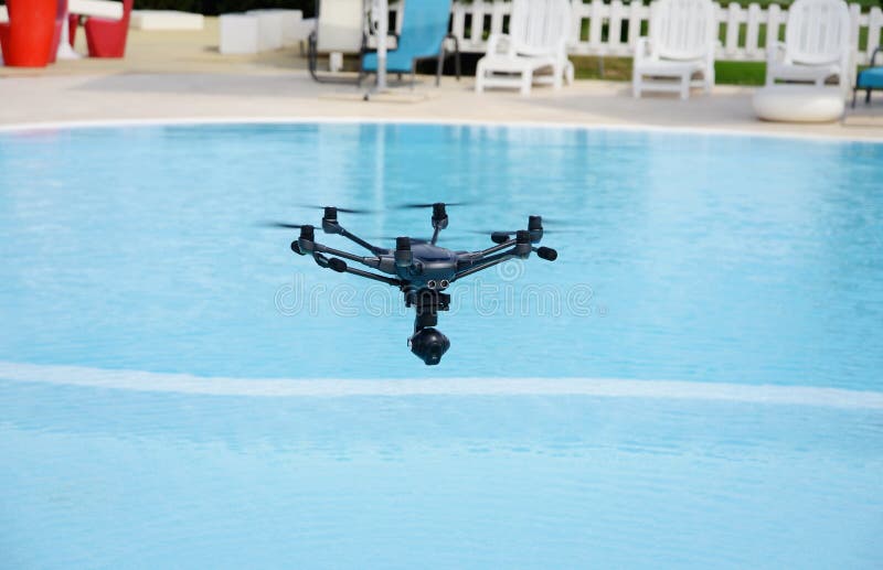 Drone Hovering Over Swimming Pool Stock Image - Image of horizontal ...
