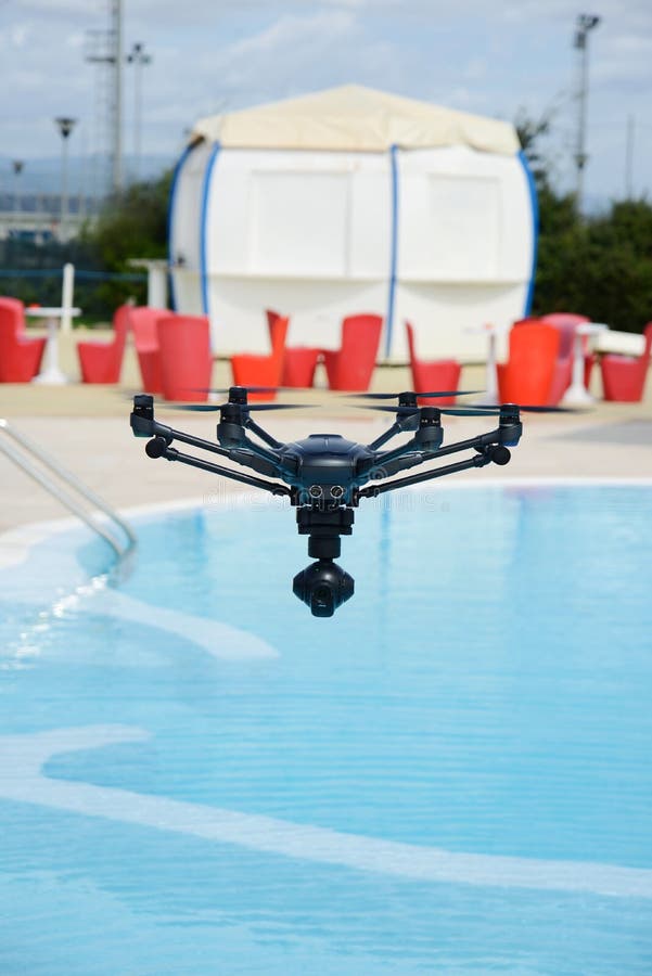 Drone Hovering Over Swimming Pool Stock Image - Image of robot ...