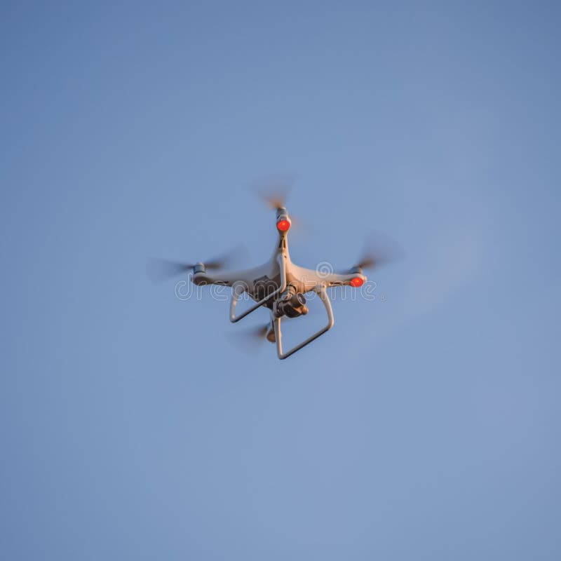 The Drone, Hovering in the Sky. Flight Quadrocopters Stock Photo ...