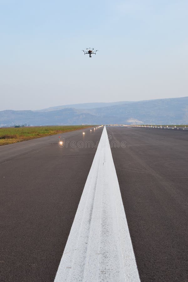 Drone Inspection Over Airport Runway with Operator Stock Photo - Image ...
