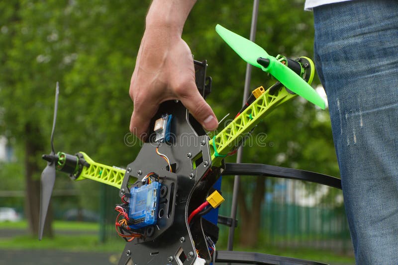 Drone in male hand stock photo. Image of quadrocopter - 92633448