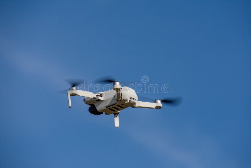 Drone in Mid-flight in the Blue Autumn Sky Stock Image - Image of ...