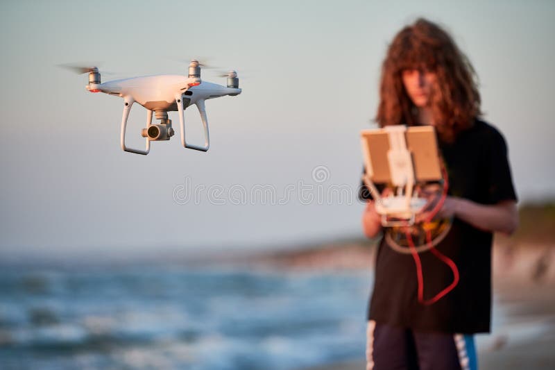 Drone Operated by Young Man Flying Over an Sea Stock Image - Image of ...