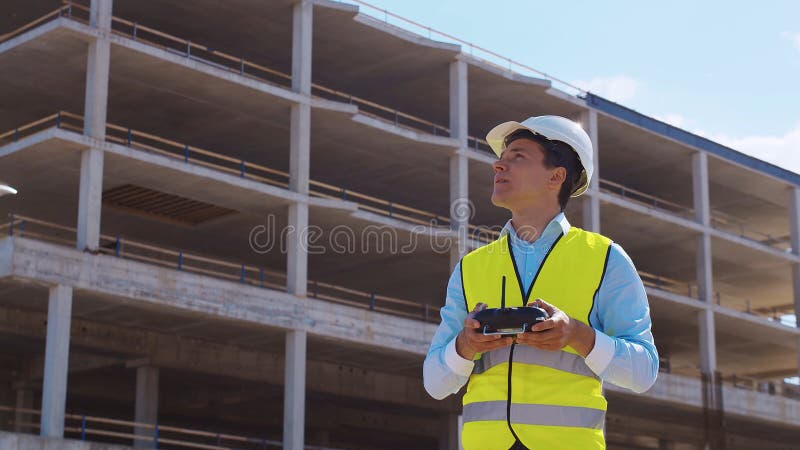 Drone Operator Holding Remote Controller. Professional Builder in ...