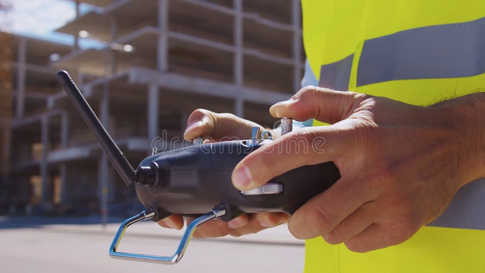 Drone Operator Holding Remote Controller. Professional Builder in ...