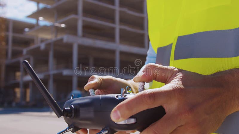 Drone Operator Holding Remote Controller. Professional Builder in ...