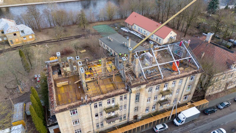 Drone Photography of Construction Workers Building New Rooftop on Old ...