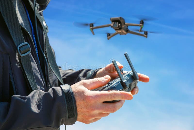 Drone and pilot in action stock photo. Image of camera - 245647048