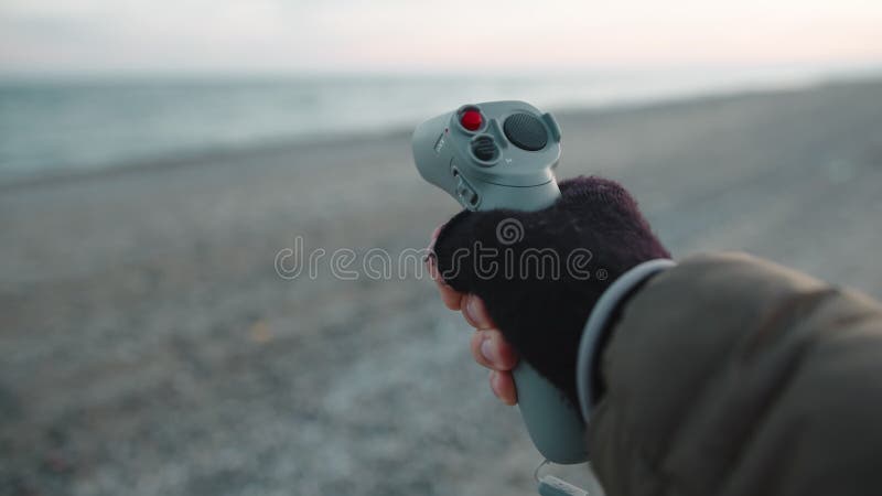 Drone Pilot is Controlling the Aircraft with a Remote Single Hand ...