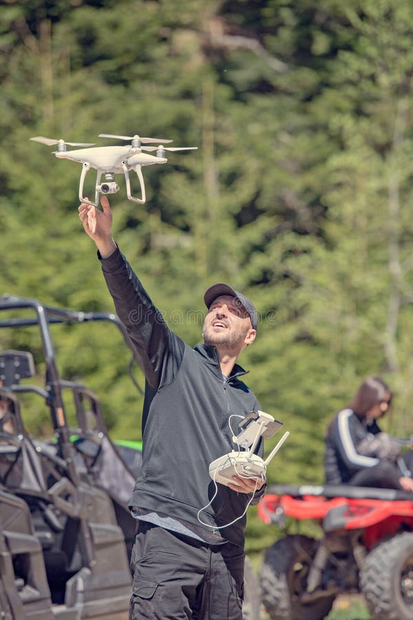 A Drone Pilot Prepares To Catch a Descending Drone Quad Chopter about ...