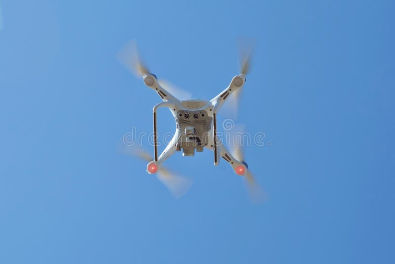 Drone Quad Copter with High Resolution Digital Camera on the Sky .White ...