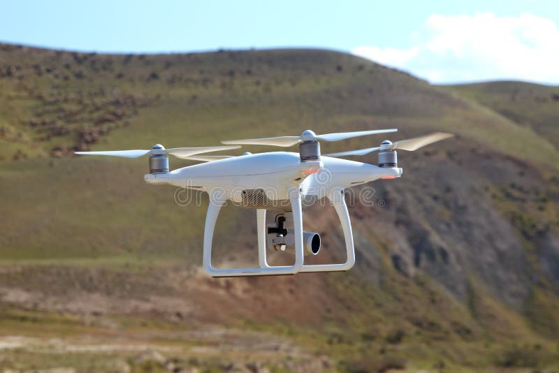 Drone Quad Copter with High Resolution Digital Camera on the Sky .White ...