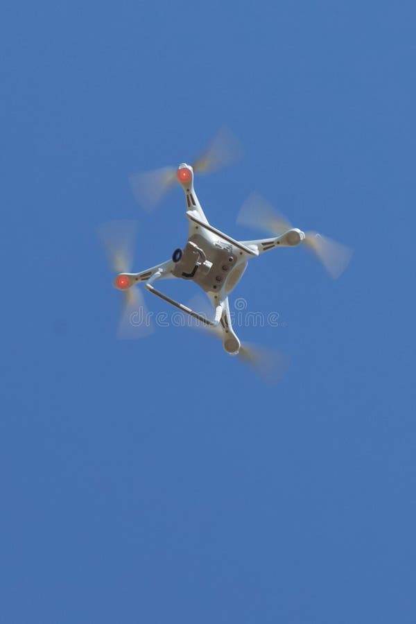 Drone Quad Copter with High Resolution Digital Camera on the Sky .White ...