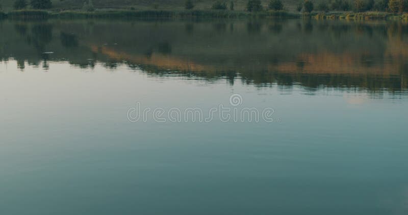 A Drone Records a Beautiful Lake Flying Low Over the Water. Stock Image ...