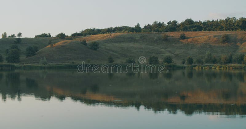 A Drone Records a Beautiful Lake Flying Low Over the Water. Stock Image ...
