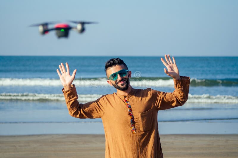 Drone Remote Control. Arabian Man Operating Copter Controller ...