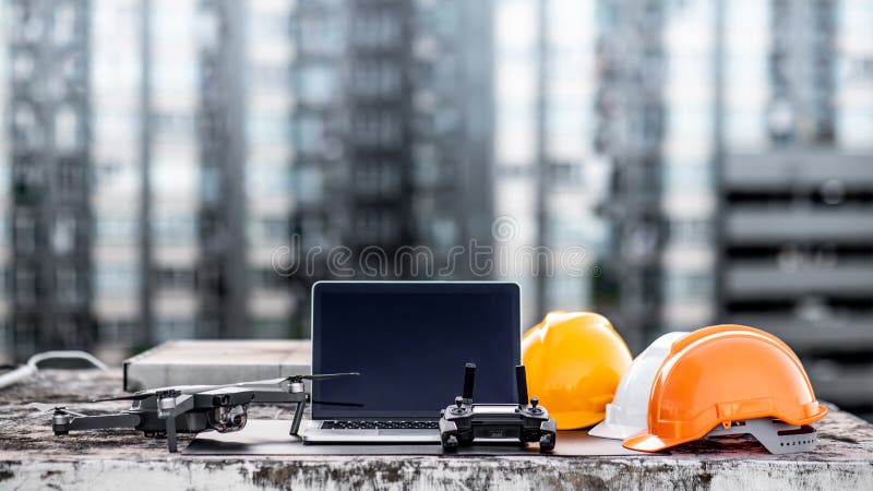 Drone, Remote Control, Laptop and Helmet at Construction Site Stock ...