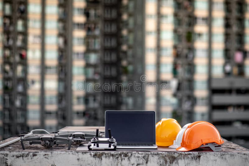 Drone, Remote Control, Laptop and Helmet at Construction Site Stock ...