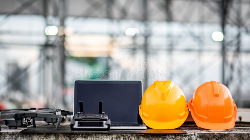 Drone, Remote Control, Laptop and Helmet at Construction Site Stock ...