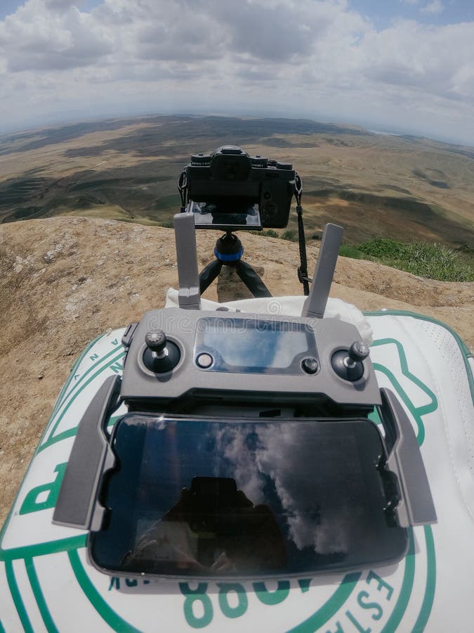 Drone Remote Controller with Phone and Camera in Mountains Editorial ...