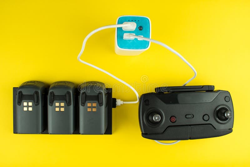The Drone`s Batteries are Being Charged by the Power Bank. the Remote ...