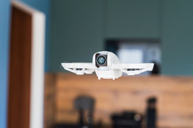 A Drone with a Security Camera Hovers in the Air Inside a House ...