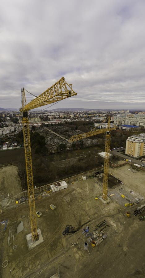 Drone Shot of a Crane Working on a Construction Site Stock Photo ...