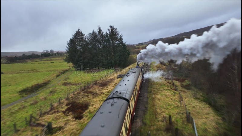 Drone Shot of Steam Train Going on a Railway Track in Natural Landscape ...