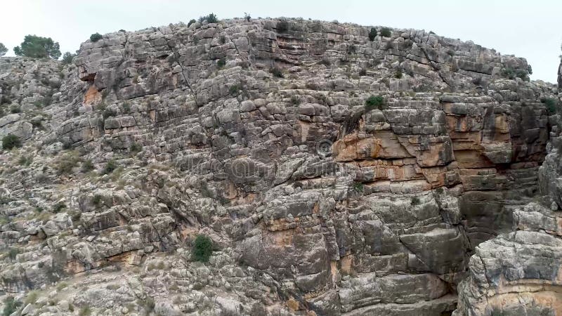 Drone Shot of a Steep Cliff with Geological Erosion Patterns Stock ...