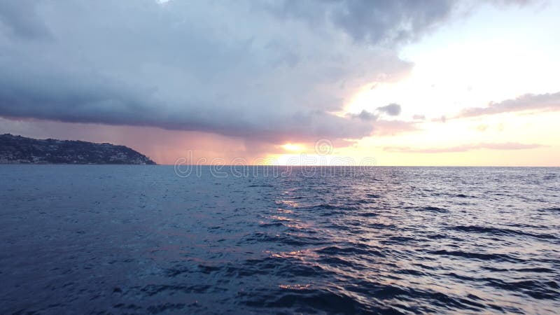 Drone Sunset Footage of a Shiny Sea with Silhouette Coast Trees and ...