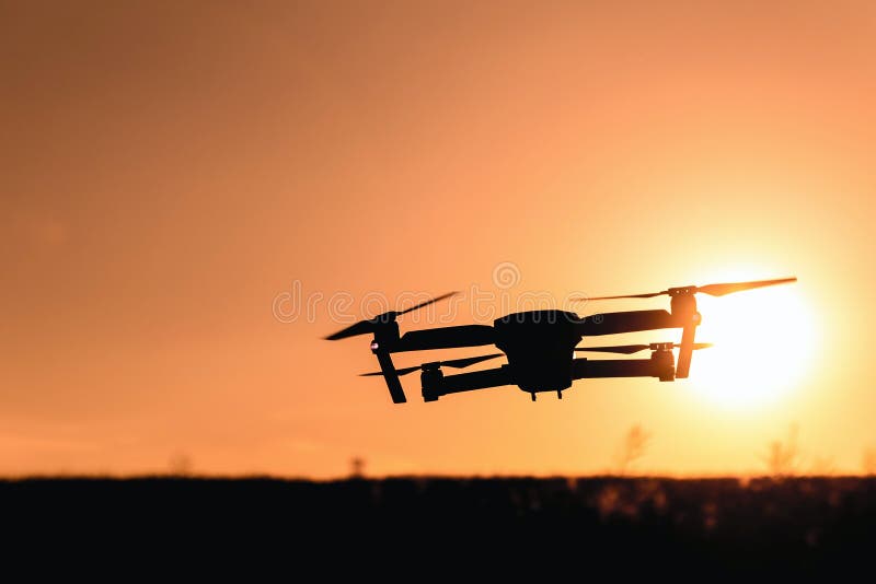 The Drone in the Sunset Sky Stock Photo - Image of closeup, aerial ...