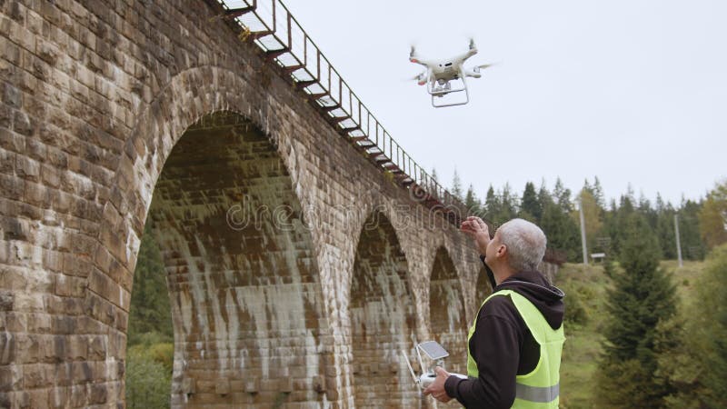 Drone Under a Bridge Doing an Inspection. Inspection of the Old Bridge ...