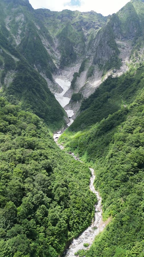 Drone Vertical Scenery of a Trail between Terrain of Mountain Covered ...