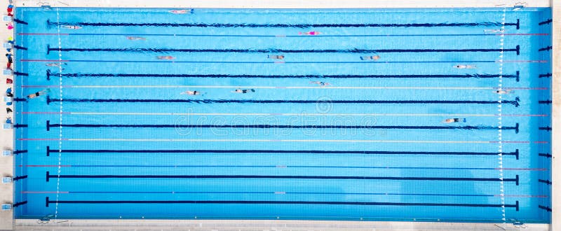 Drone Video of Swimmers in a Clear Blue Pool, Captured from Above. the ...