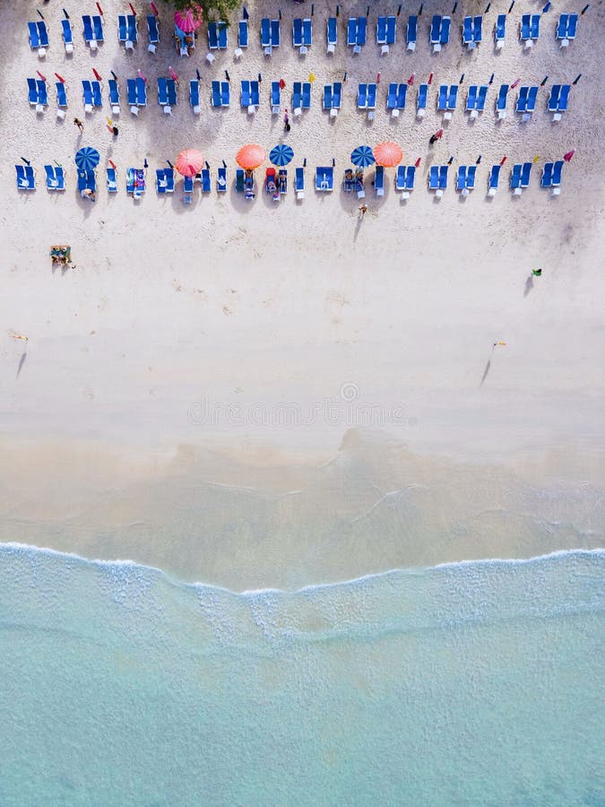 Drone View from Above at Ocean and Beach with Chairs and Umbrellas ...