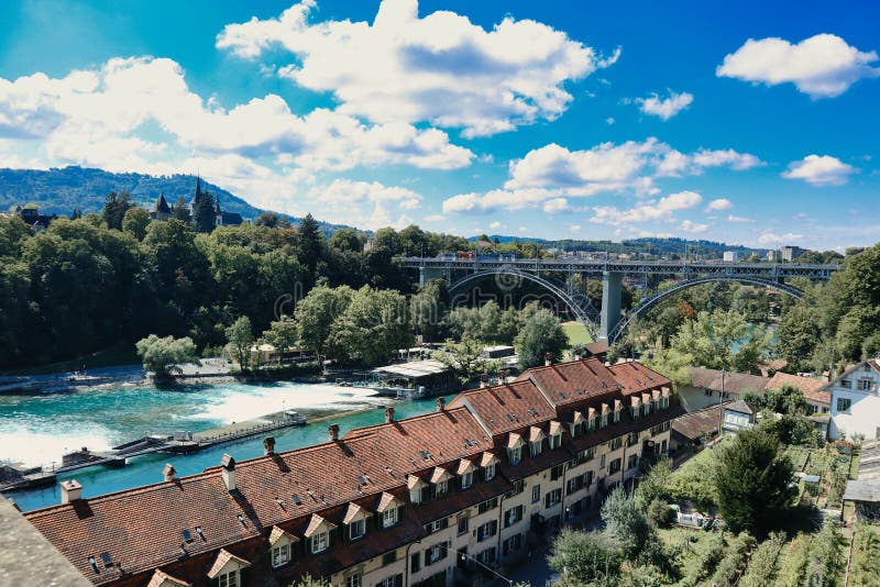 Drone View of Bern with Red-tiled Buildings by a River with Trees and a ...