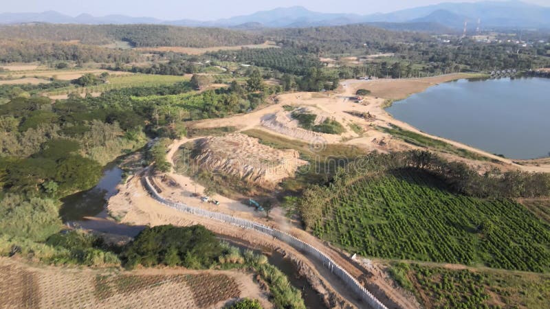 Drone View of a Channel Flows between Agricultural Fields in the ...