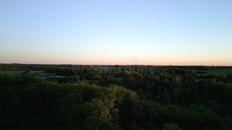 Drone View of a Countryside with Green Forests and Fields Under Blue ...