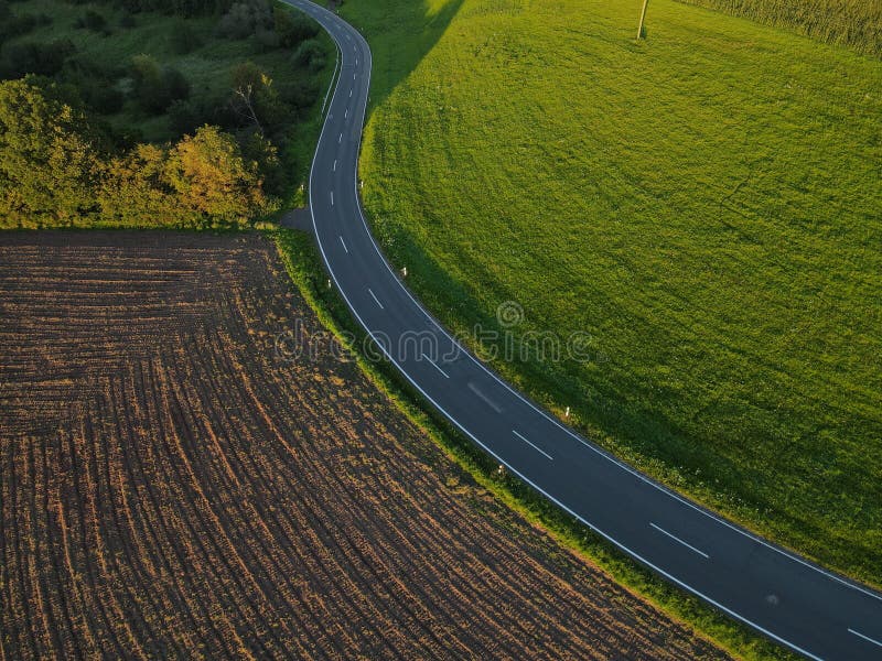 Drone View of a Curved Road between Agriculture Fields in the Landscape ...