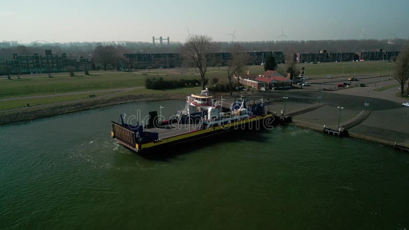 Drone View of a Ferry in Scheur River, Moored by the Dock and Cars ...