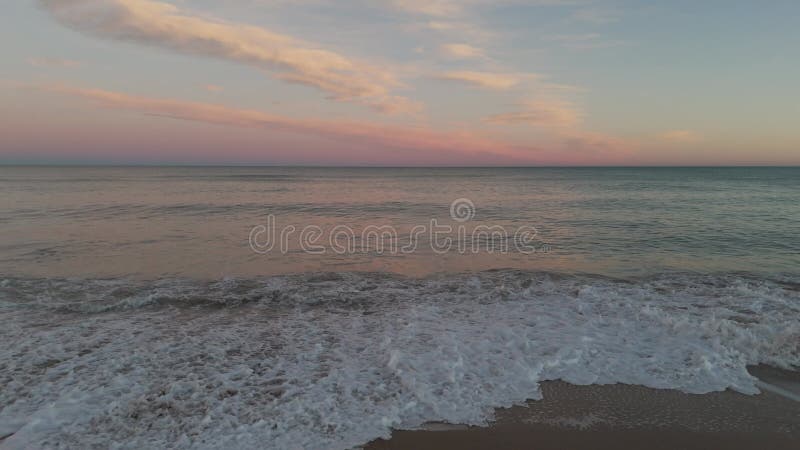 Drone View Flying in Parallel of a Sandy Beach during Sunrise Stock ...