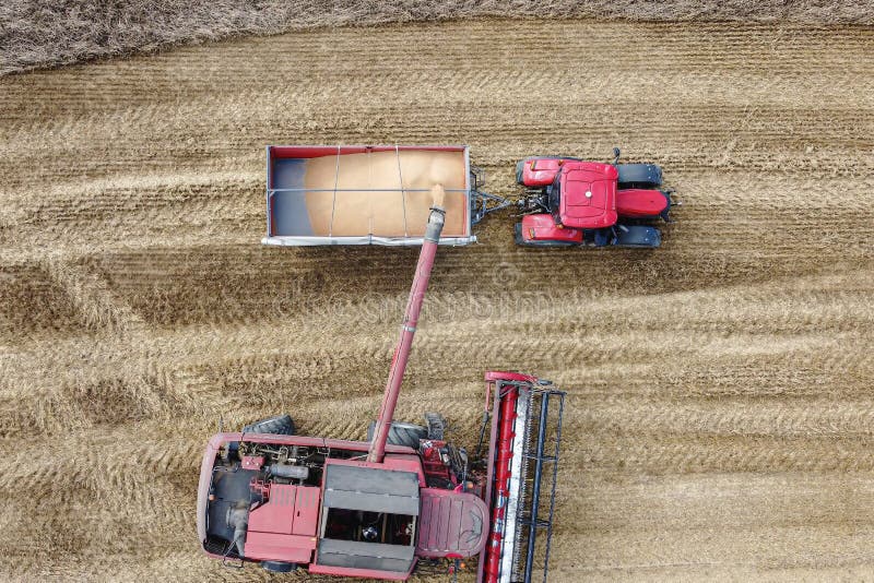 Drone View of the Pier Loading Grain from a Combine into a Grain Truck ...
