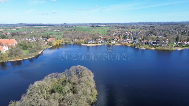 Drone View of a Small Lake in Low Sun Surrounded by Fields and Woods ...