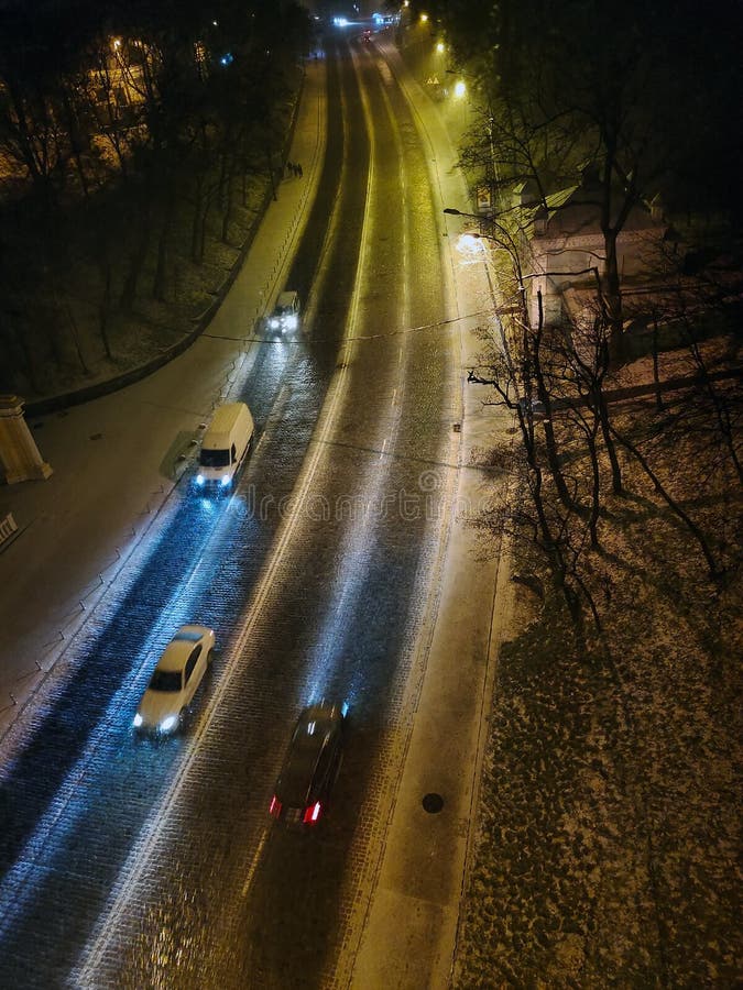 Drone View of a Winter Night Road with Passing Cars Below Stock Image ...