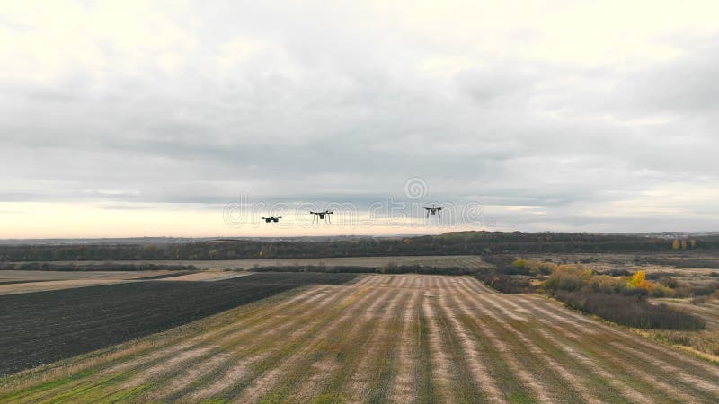 Drones Flying Alongside Trucks on a Highway during Overcast Weather ...
