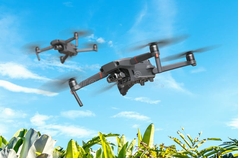 Drones Flying Over field stock photo. Image of outdoors - 151000790