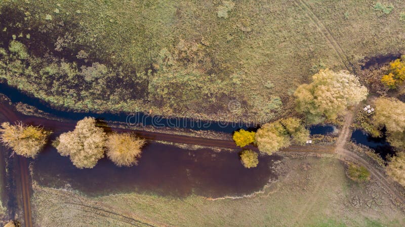 Drop Down View of River Flowing through Fields after Harvest. Stock ...