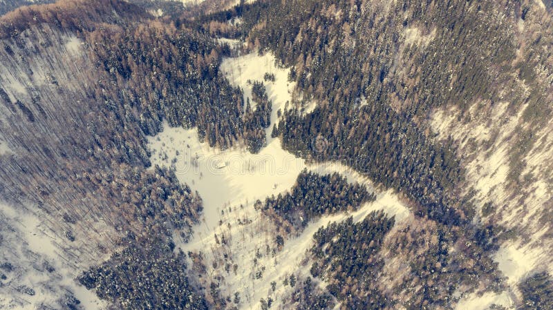 Drop Down View of Road Going through Winter Forest. Stock Photo - Image ...