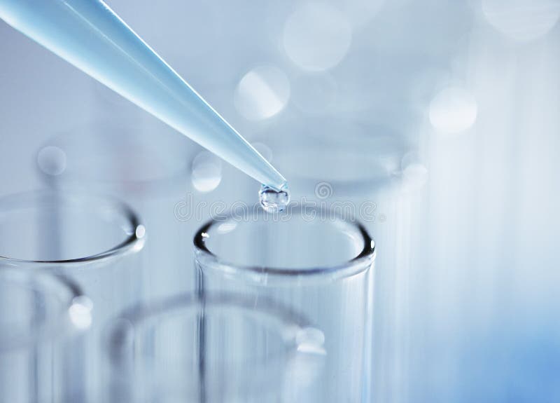 Drop by Drop. an Unknown Person Inserting Sample Fluid into Test Tubes ... Drop by Drop. an Unknown Person Inserting Sample Fluid into Test Tubes ...