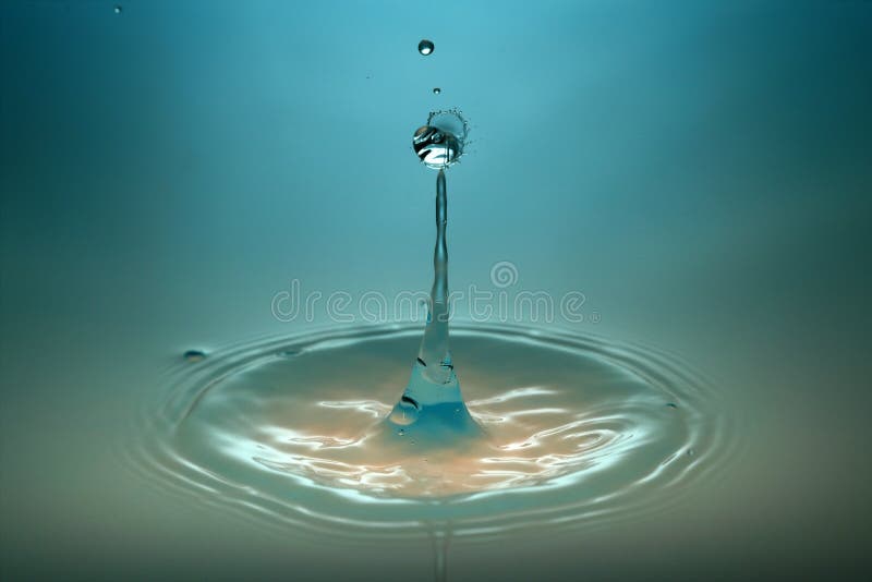 A Drop Falls into the Water, Forming a Column with a Figure Stock Image ...
